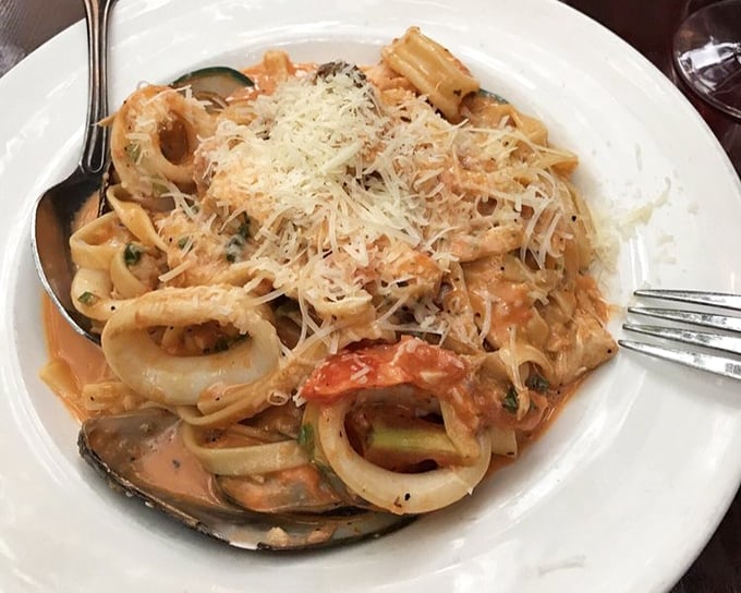 Seafood pasta that brings the ocean to your fork &ndash; a harmonious medley of shellfish, pasta, and creamy tomato sauce topped with freshly grated cheese.