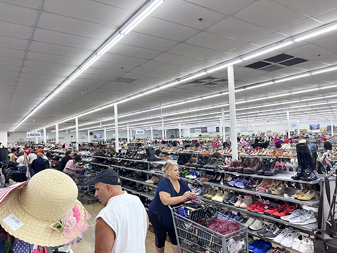 The shoe section sprawls with possibilities, each pair telling its own story while shoppers hunt for that perfect Cinderella fit.