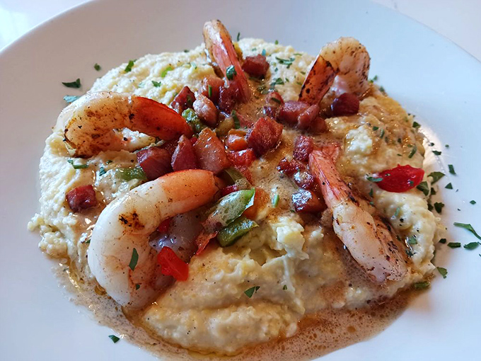 Creamy grits cradle plump shrimp while bacon adds smoky punctuation marks to this Southern symphony of flavors.