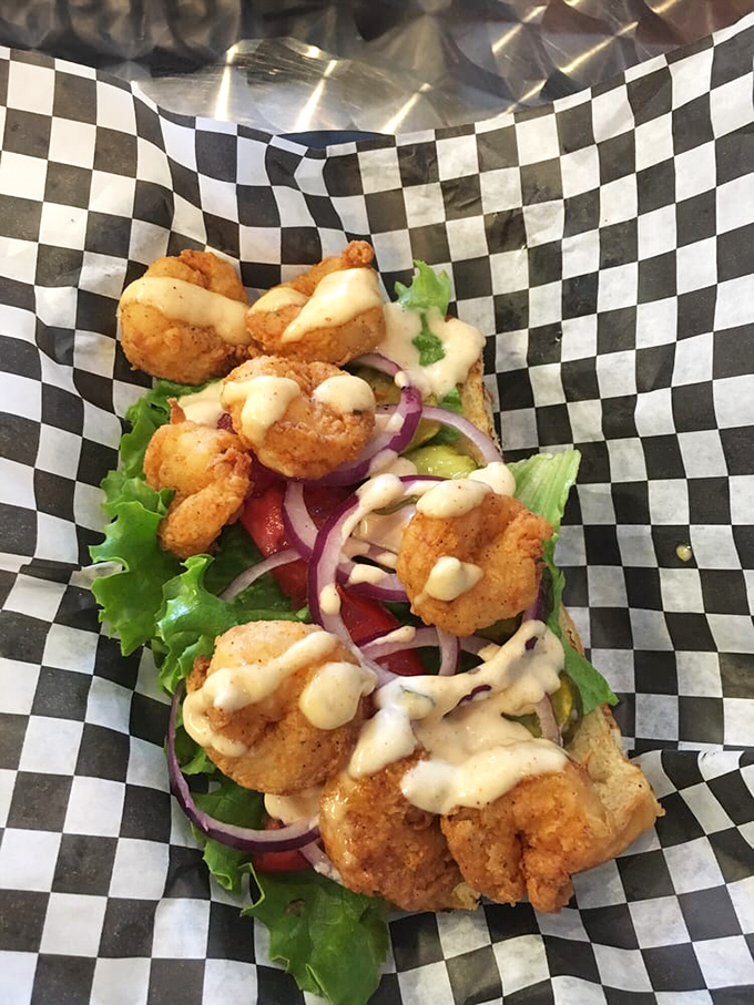 A po' boy that's rich in flavor. Crispy shrimp, fresh veggies, and sauce that drips down your arm&mdash;the hallmark of any sandwich worth eating.