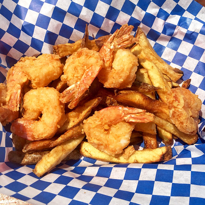Plump, golden shrimp nestled among crispy fries&mdash;a seafood treasure chest that makes you wonder why you'd ever order anything else.