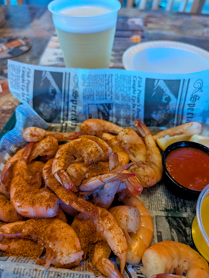 Peel-and-eat shrimp served on newspaper - because reading about world problems seems less important when you're dealing with seafood this good.
