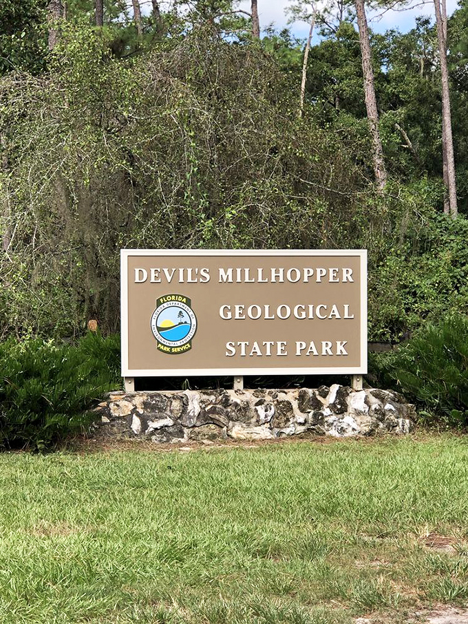 The official signage stands like a humble gatekeeper, never bragging about the prehistoric wonderland it's been protecting since 1974.