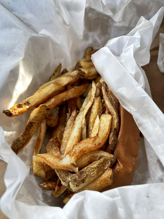 Hot dog architecture at its finest&mdash;mustard, onions, relish, and sport peppers creating the perfect balance of snap, tang, and heat.