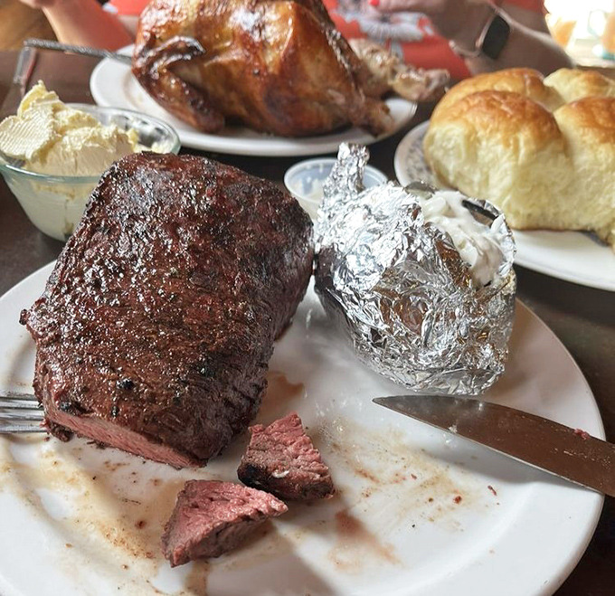 The steak doesn't just hang off the plate&mdash;it establishes dominance over it. That baked potato in foil? It's hiding in fear.