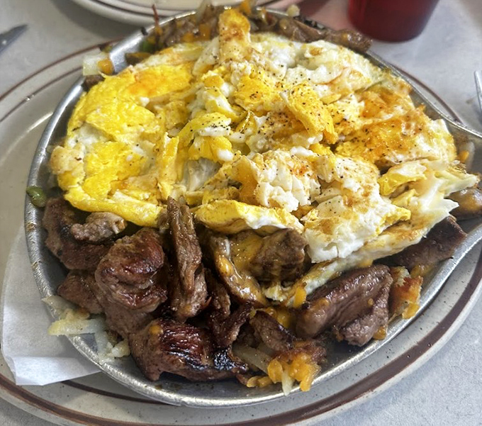 This sizzling skillet doesn't just arrive at your table&mdash;it makes an entrance, demanding respect with its mountain of steak and eggs.