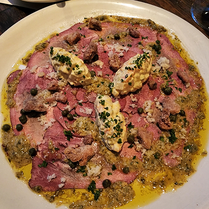 Smoked beef tongue swimming in a vibrant sauce with dollops of something creamy&mdash;proof that the best foods are often the ones we're initially afraid to try.