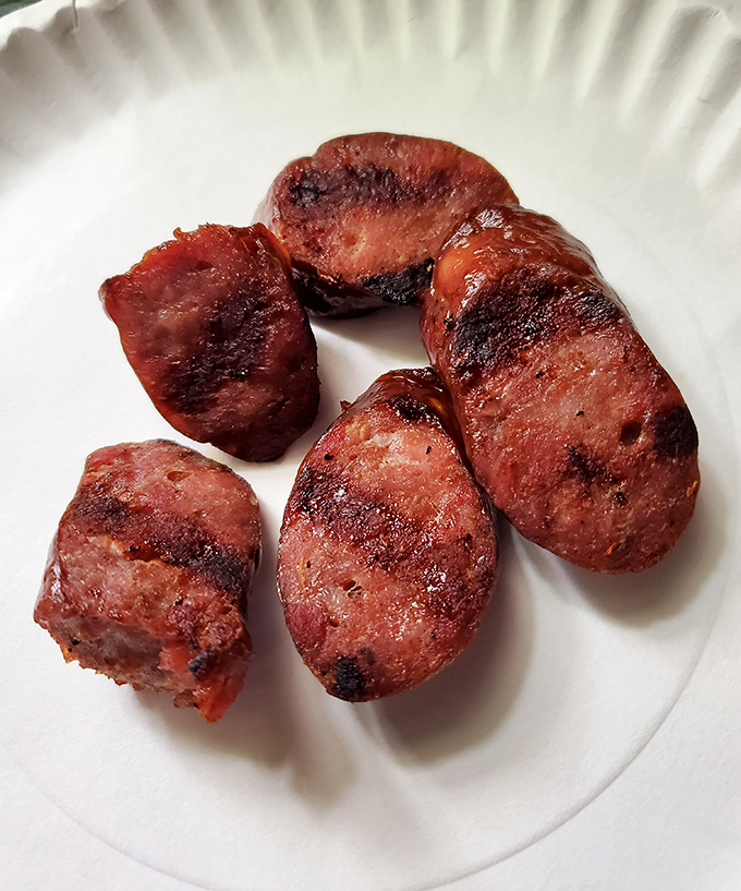 Behold the star of the show&mdash;kielbasa slices glistening with smoky perfection, each bite a reminder that simplicity often trumps culinary showboating.