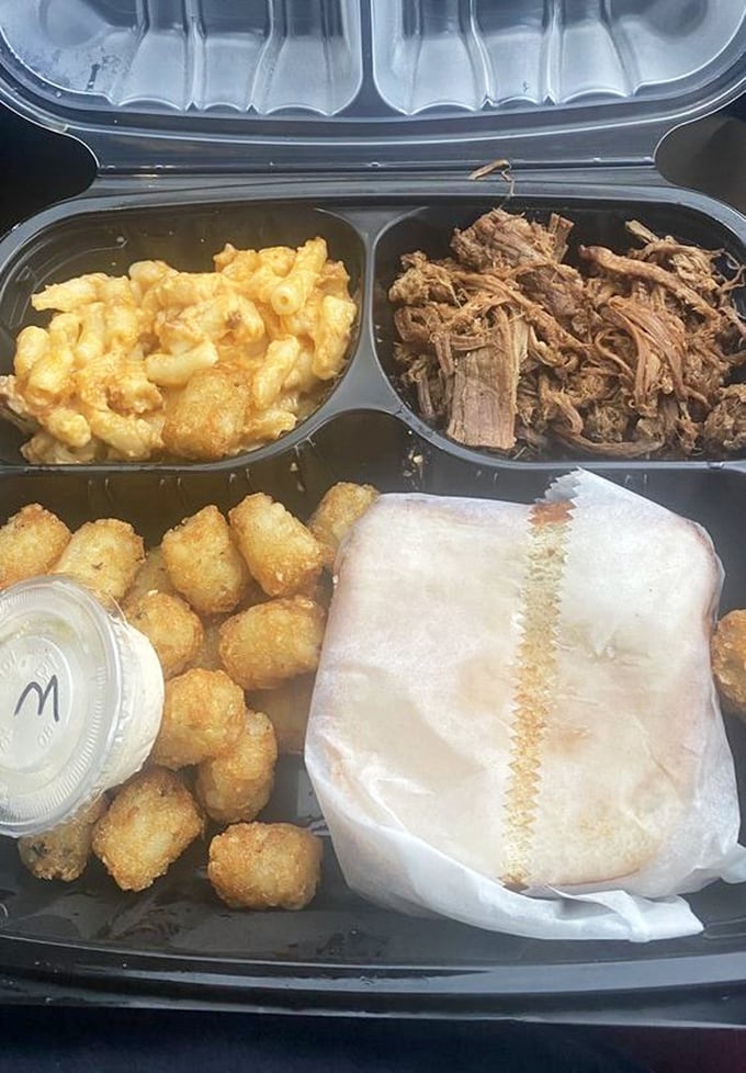 The holy trinity of barbecue sides: smoked mac, tender brisket, and golden tots create pure harmony.