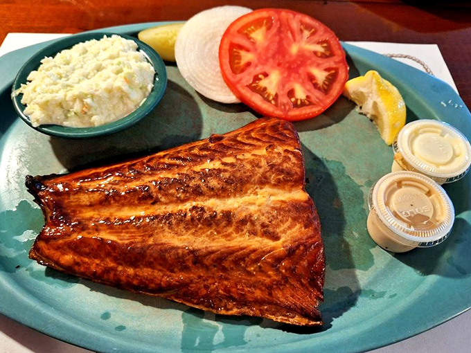 This smoked salmon doesn't need bagels or capers to shine. Just a squeeze of lemon and a moment of silence to appreciate its perfect smoky essence.