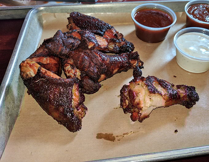 These chicken pieces have spent more time in the smoker than most people spend at the gym, and the results speak for themselves.