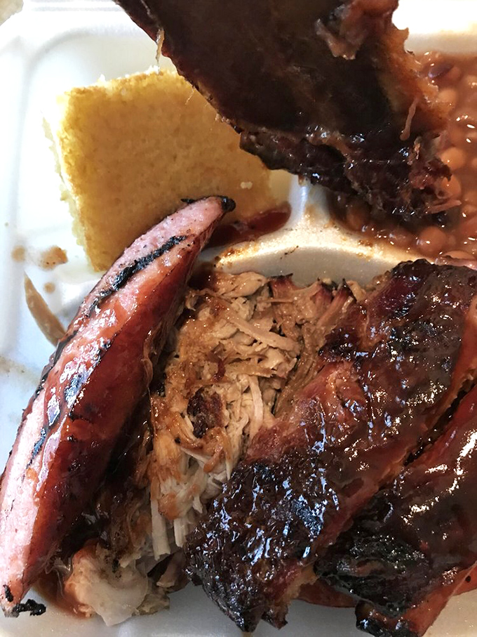 Smoked sausage, pulled pork, and cornbread: the holy trinity of BBQ that proves heaven exists and it's located in Cleveland, Ohio.