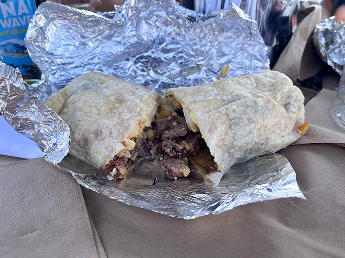 The breakfast burrito that makes morning people out of night owls. Wrapped in foil like the precious gift it is, revealing a cross-section of savory morning bliss.