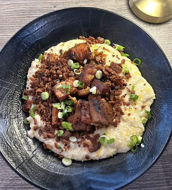 Grits transformed from Southern staple to canvas for pork perfection. Those green onions aren't garnish&mdash;they're the world's tiniest "I'm being healthy" alibi.