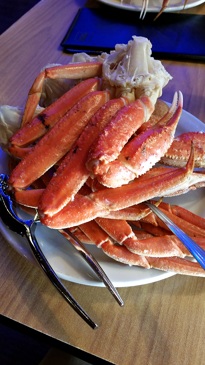 Snow crab legs arranged like nature's own puzzle. The reward for your cracking efforts? Sweet, tender meat that makes the labor feel like leisure.