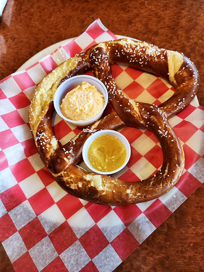 A soft pretzel that would make any Bavarian proud, served with mustard and cheese sauce for double-dipping delight.