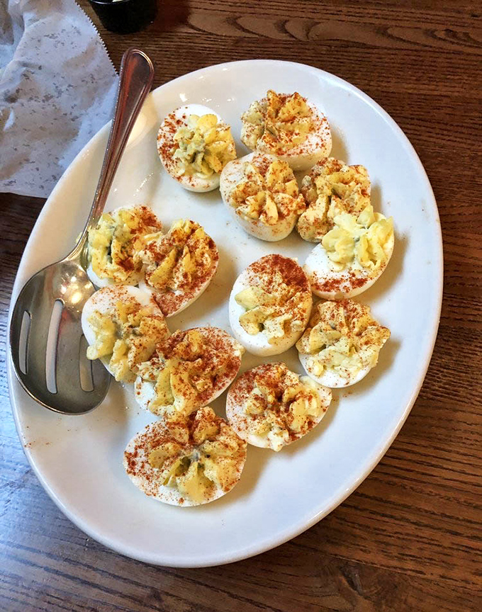 These aren't your standard picnic deviled eggs; they're little Southern masterpieces dusted with paprika and filled with creamy, tangy perfection.