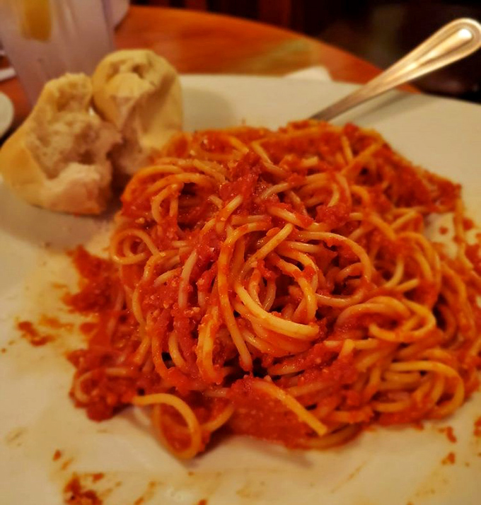 Spaghetti marinara so perfectly twirl-able it deserves its own Olympic category. That roll on the side is just waiting for sauce-sopping duty.