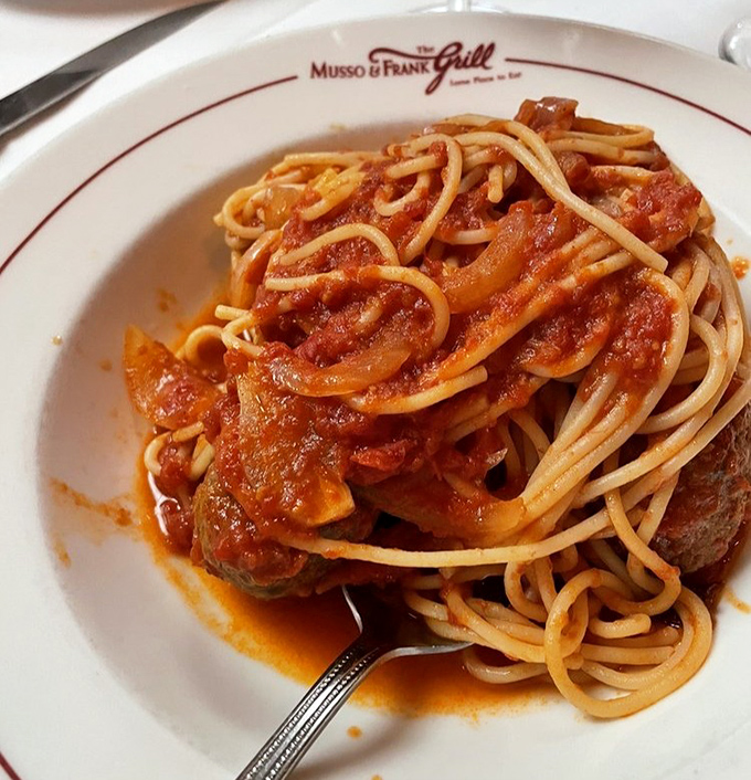 Spaghetti that would make any nonna proud. The sauce clings to each strand with the determination of an actor refusing to let go of their big break.
