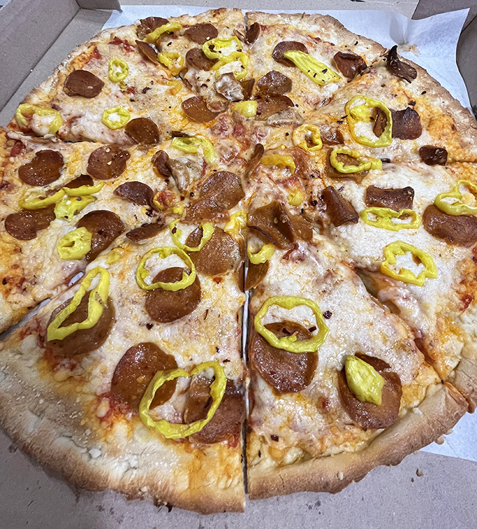 Banana peppers and pepperoni living harmoniously together&mdash;if only world peace could be achieved through pizza toppings.