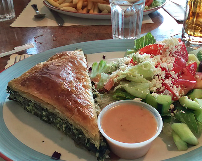 Spanakopita that flakes just right&mdash;buttery phyllo giving way to a spinach filling that tastes like someone's grandmother supervised its creation.