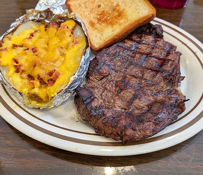 A steak seared to perfection alongside a loaded baked potato. This isn't just dinner &ndash; it's a celebration on a plate.