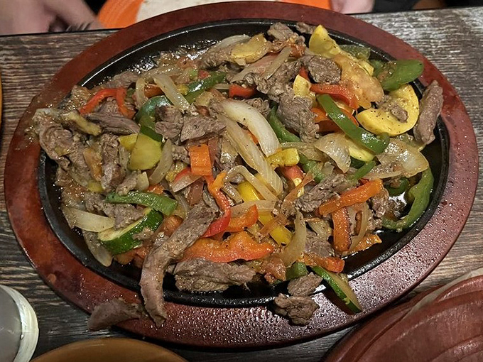 Sizzling fajitas that announce their arrival before you see them. The aroma alone is worth the trip, but those caramelized vegetables seal the deal.