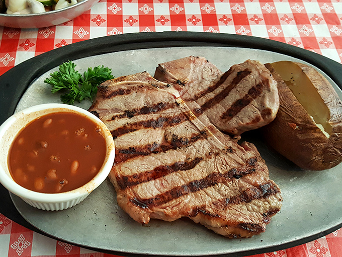 Perfectly grilled steak with grill marks that could win an art competition. The baked potato stands by like a loyal sidekick.