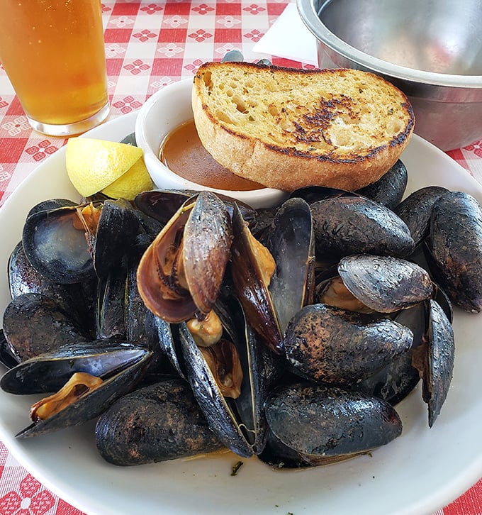 These mussels have clearly been working out&mdash;plump, glistening, and ready to take a delicious dive into that golden broth.