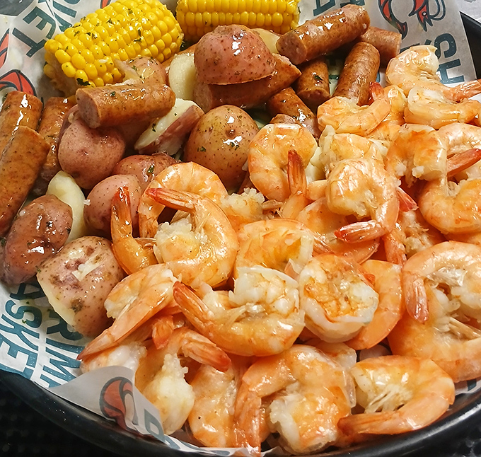 The seafood boil that launched a thousand napkins. Plump shrimp, corn, and potatoes swimming in seasoned glory&mdash;no utensils required.