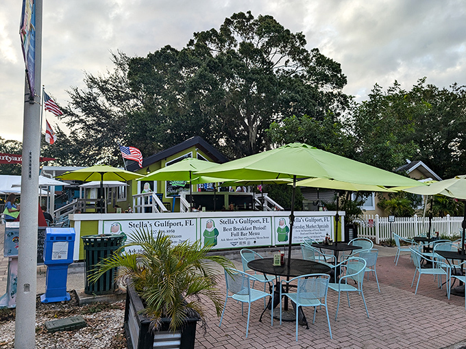 Stella's outdoor seating area proves that breakfast tastes better under lime-green umbrellas with a side of Gulf breeze.
