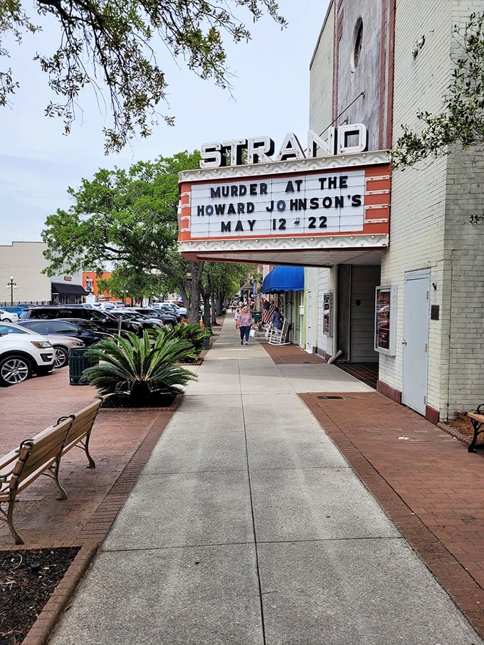 The Strand Theater's vintage marquee still announces shows with old-school panache, a reminder that some entertainment doesn't need downloading or buffering.