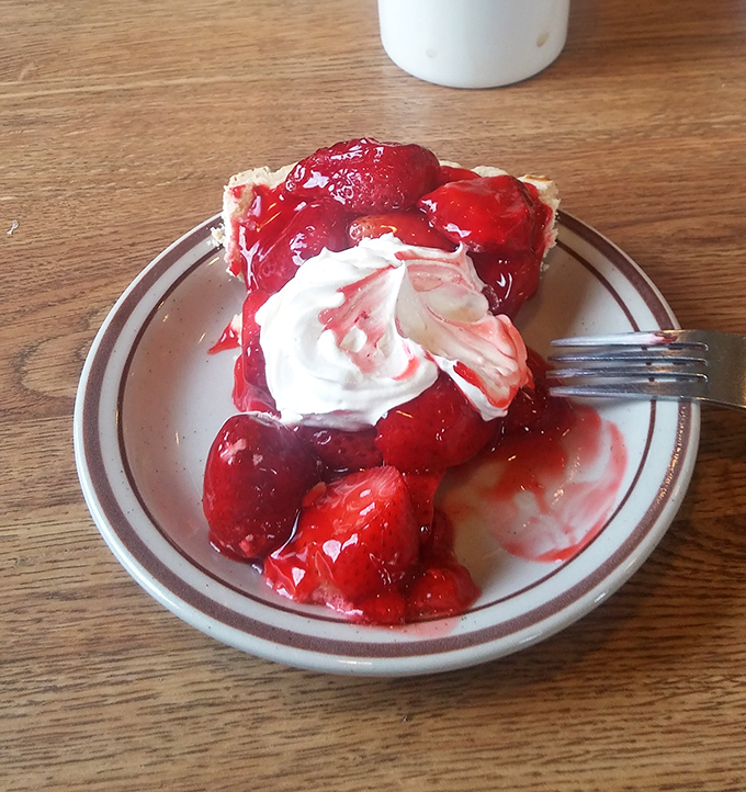 Ruby-red strawberry pie that would make Dorothy's slippers jealous. That swirl of whipped cream isn't just decoration&mdash;it's a necessary indulgence.