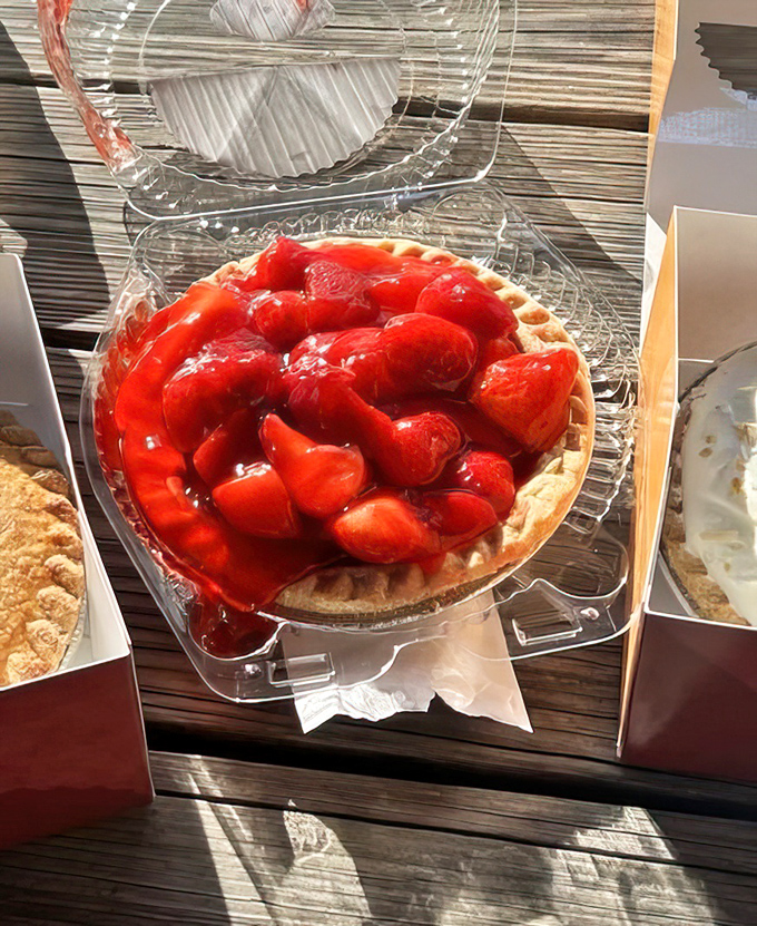 Summer captured in a crust&mdash;plump strawberries glisten like rubies atop cream filling, making this pie worth every napkin you'll need.