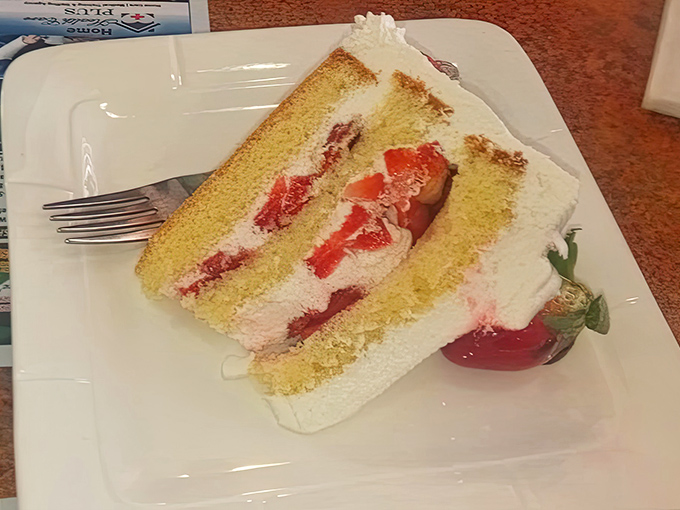 Layer cake that makes birthday candles nervous about living up to the occasion. Fresh strawberries add just the right touch of tartness.