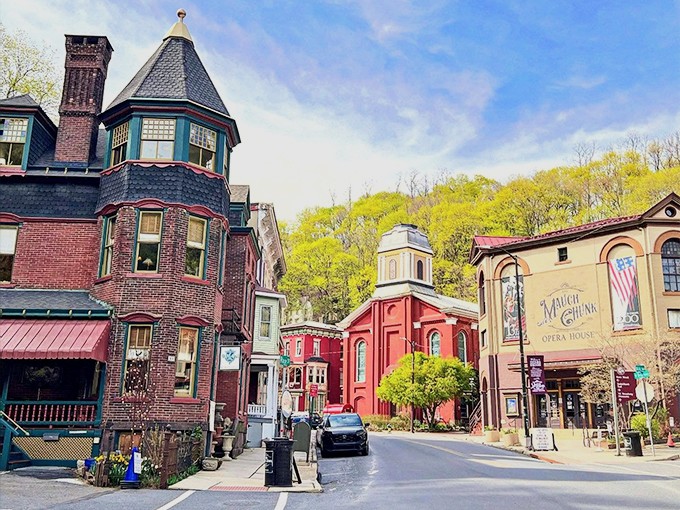 Church spires and Victorian turrets punctuate the skyline, creating a streetscape that feels more European film location than Pennsylvania small town.