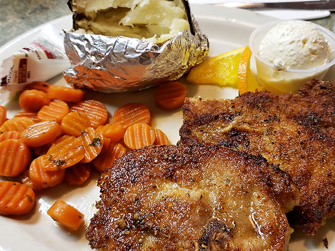 Golden-brown pork chops with perfectly cooked carrots &ndash; proof that lunch at Beeline Cafe deserves just as much fanfare as their legendary breakfasts.