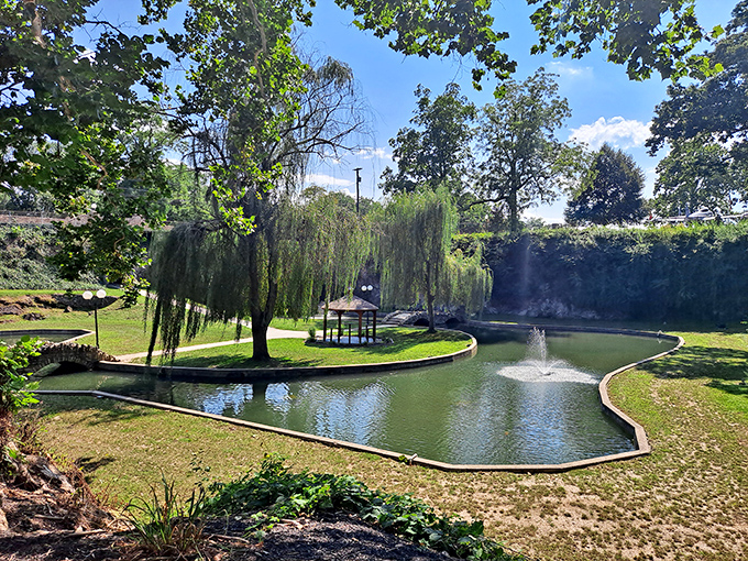 Sunken Gardens offers a serene oasis where weeping willows seem to sigh with contentment over a pond that reflects nature's perfect symmetry.