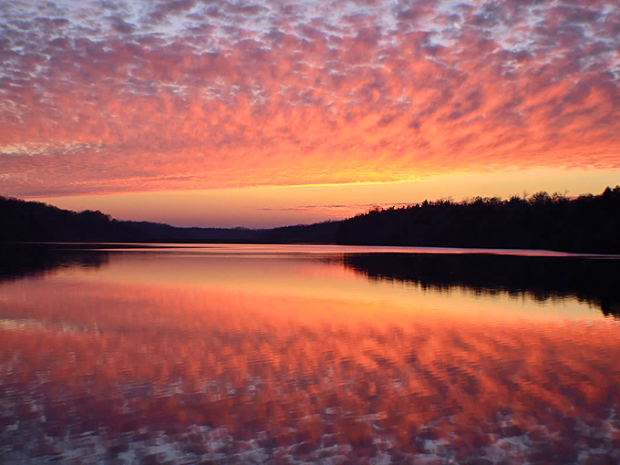 Sunset paints the sky in shades that would make Bob Ross reach for colors he hadn't invented yet &ndash; nature's perfect backdrop to Galena's natural beauty.