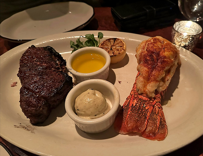 Surf and turf: where land meets sea in perfect harmony. That lobster tail looks like it's auditioning for a food magazine cover.