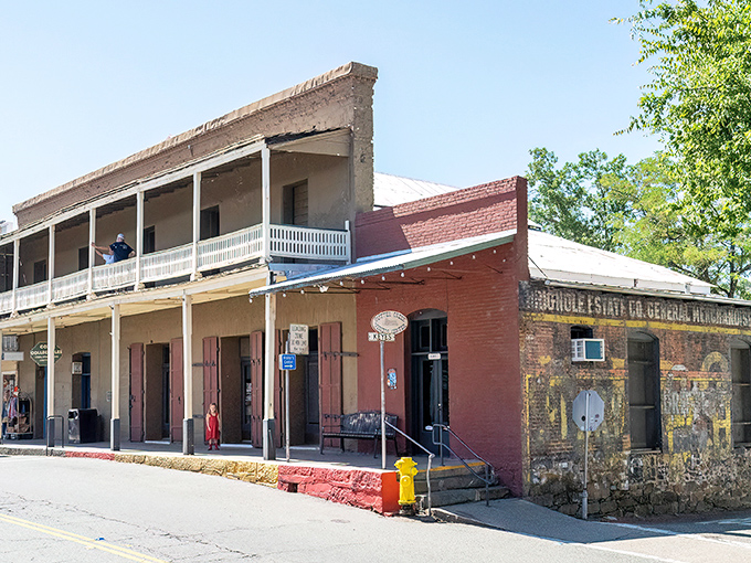 History with a front porch! This well-preserved building now welcomes visitors with information instead of general merchandise, though the charm remains fully stocked.