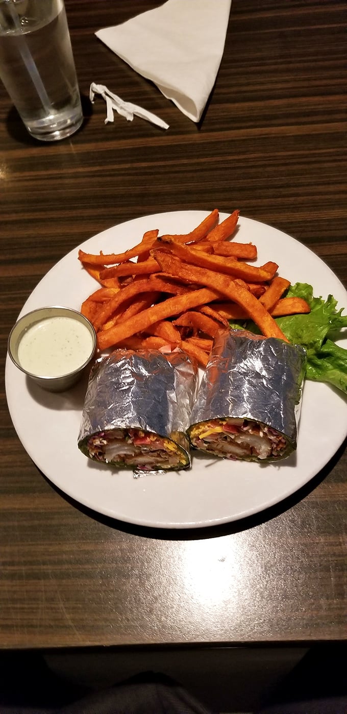 Wrapped delights flanked by sweet potato fries that look hand-cut by someone who genuinely cares about your happiness. Dipping sauce included, naturally. 