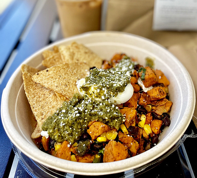 Sweet potato hash that's having a party and invited black beans, corn, and a dollop of something green and magnificent to join the celebration.
