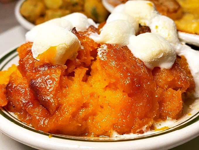 Sweet potato souffl&eacute; that straddles the line between side dish and dessert, topped with marshmallows melting like little clouds of happiness.