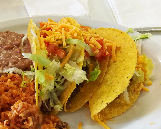 Crispy tacos standing at attention, ready to shower your shirt with delicious evidence of your good decision-making skills.