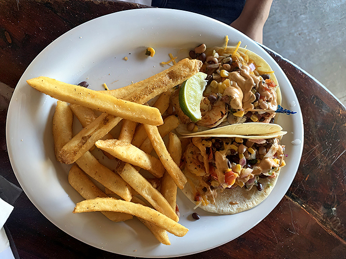 These tacos aren't just a meal; they're a fiesta on a plate. The lime wedge isn't optional &ndash; it's essential Florida flavor.