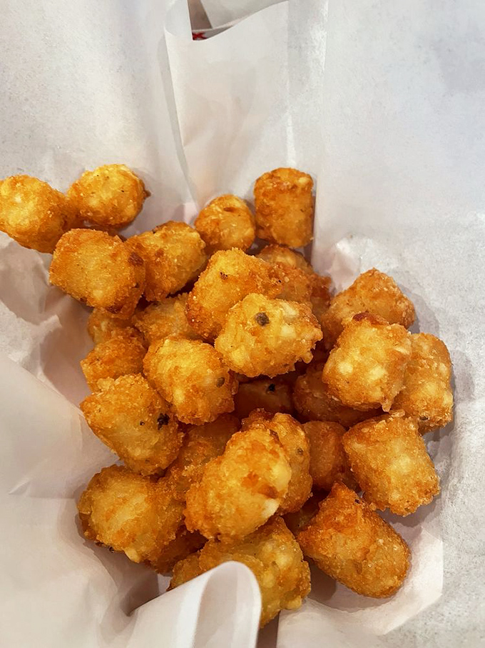 Golden-brown tater tots that crunch like your favorite childhood memory, only better because you're an adult who can order seconds.