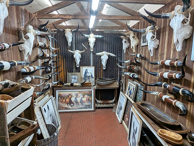 This western-themed booth transforms animal skulls and cowboy imagery into a rugged time capsule of Ozark mountain heritage.