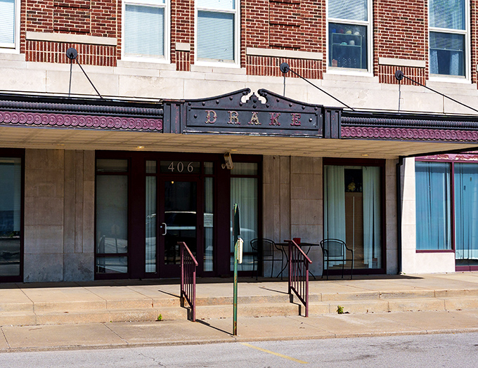 The Drake's vintage marquee hangs like a historical exclamation point, reminding passersby that entertainment existed before Netflix asked if you were still watching.