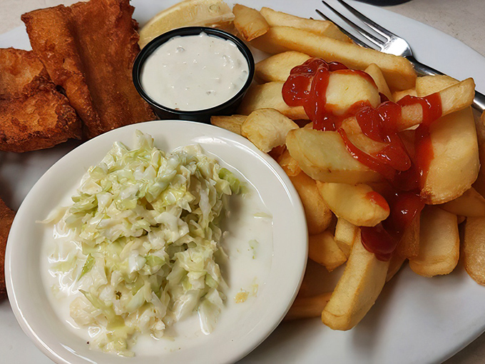 These golden fish fillets and crispy fries aren't just food&mdash;they're edible sunshine on a plate, complete with creamy coleslaw for balance.
